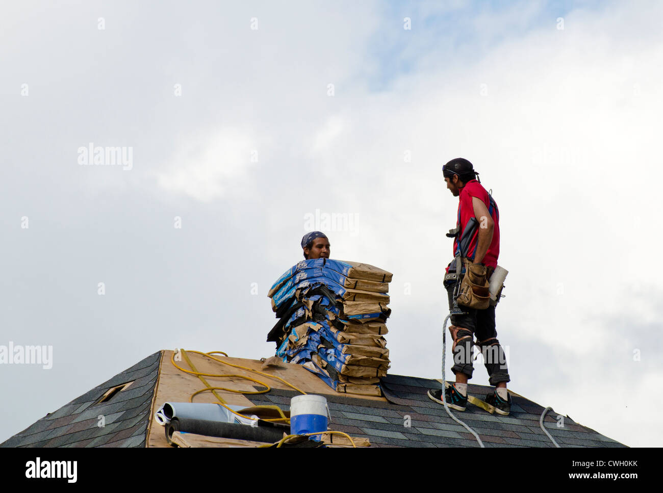 Roof shingles worker hi-res stock photography and images - Alamy