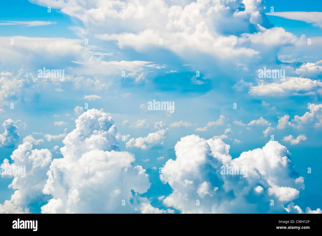 Fluffy clouds shot from airplane window Stock Photo - Alamy