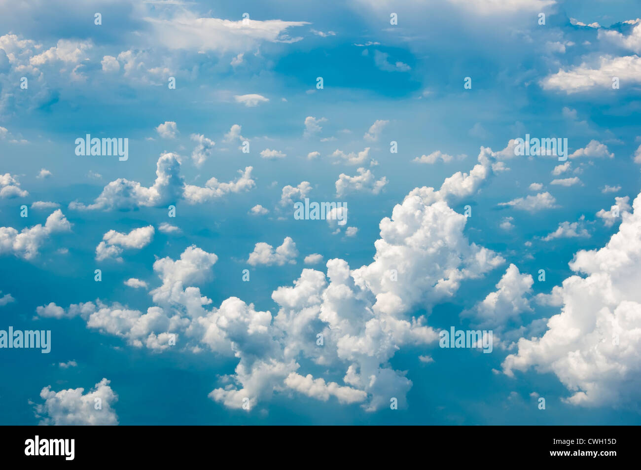 Fluffy clouds shot from airplane window Stock Photo - Alamy