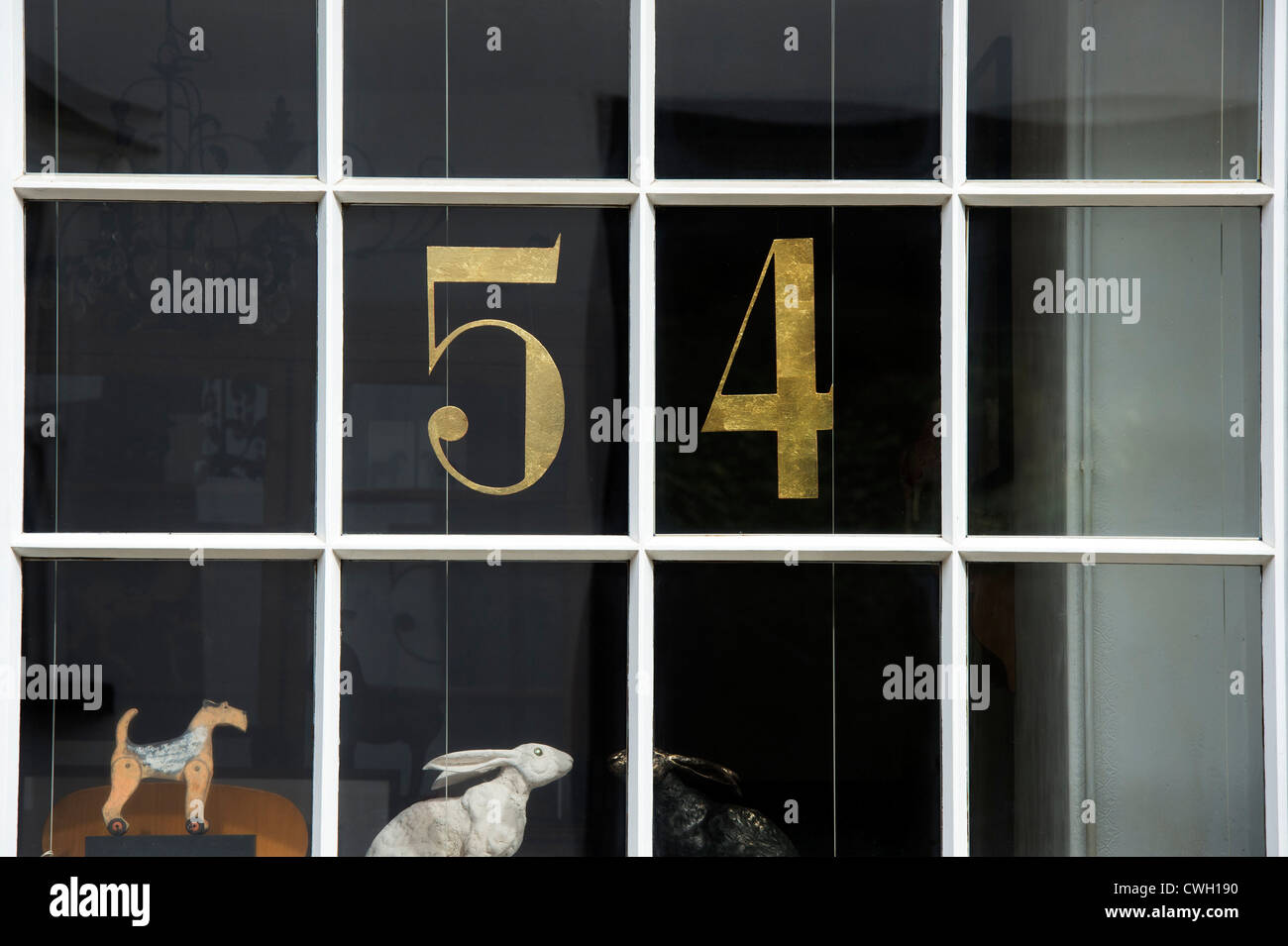 Gilded Number 54 in a shop window. Kington. Herefordshire, England ...