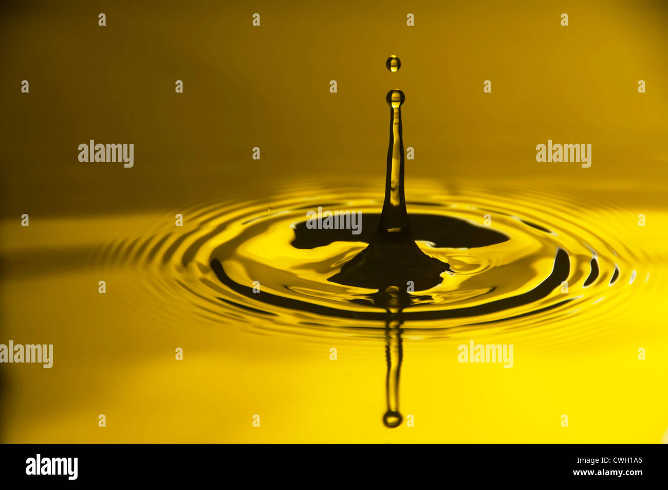Close-up of water droplet reflected on yellow background Stock Photo ...