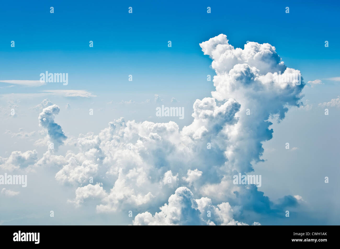 Fluffy clouds shot from airplane window Stock Photo - Alamy