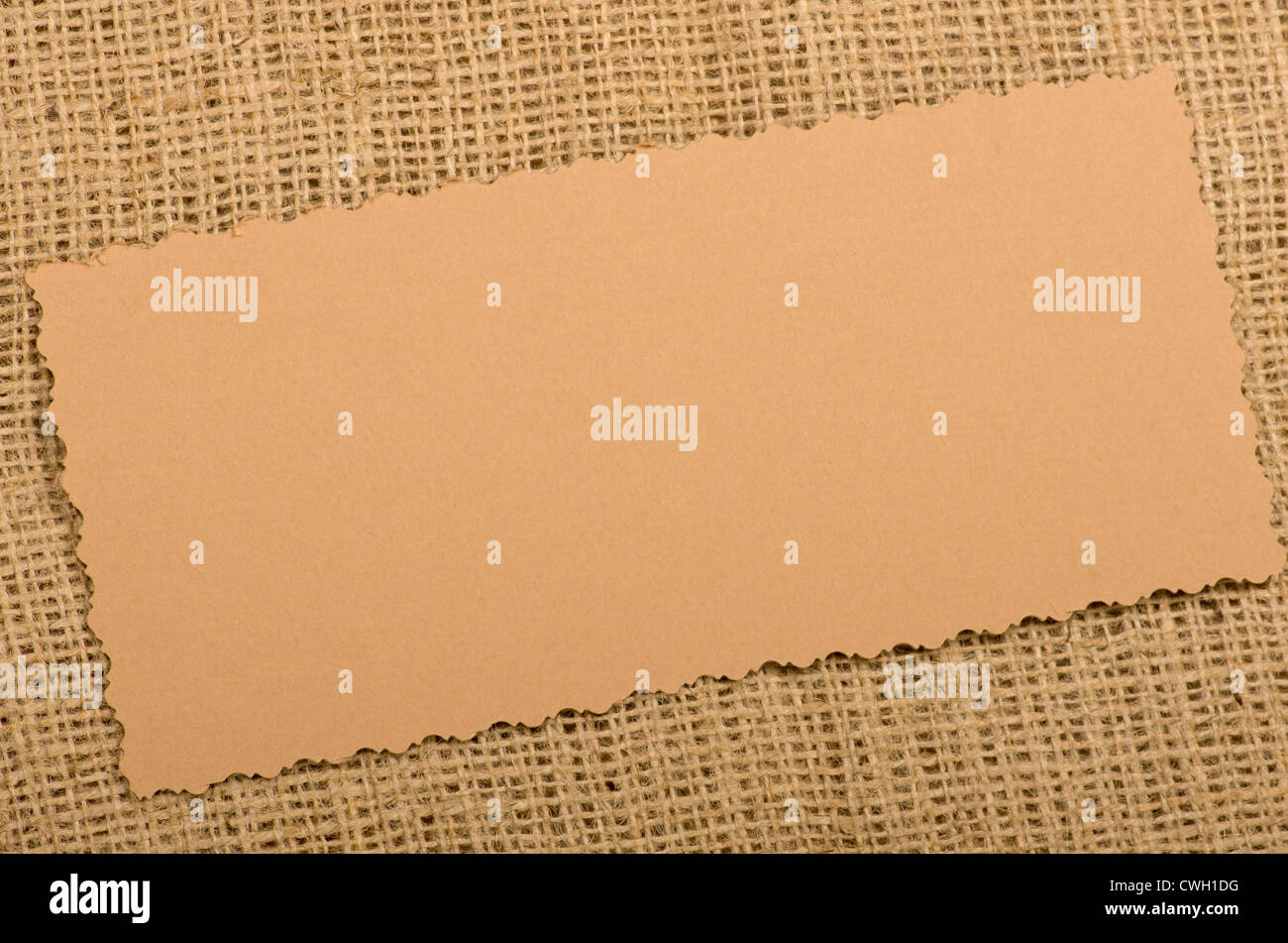Old paper tag on natural burlap Stock Photo - Alamy