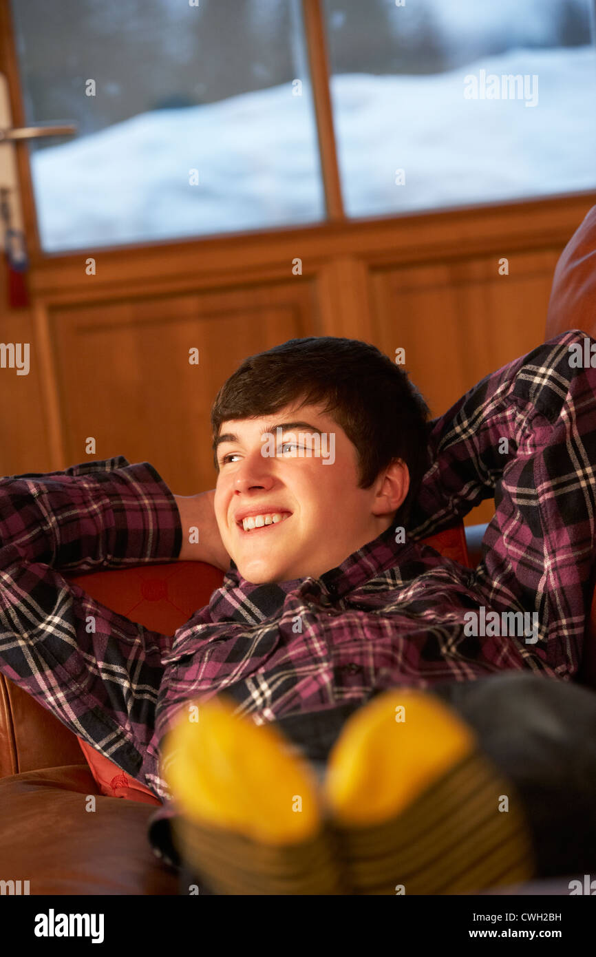 Teenage Boy Relaxing On Sofa Stock Photo - Alamy