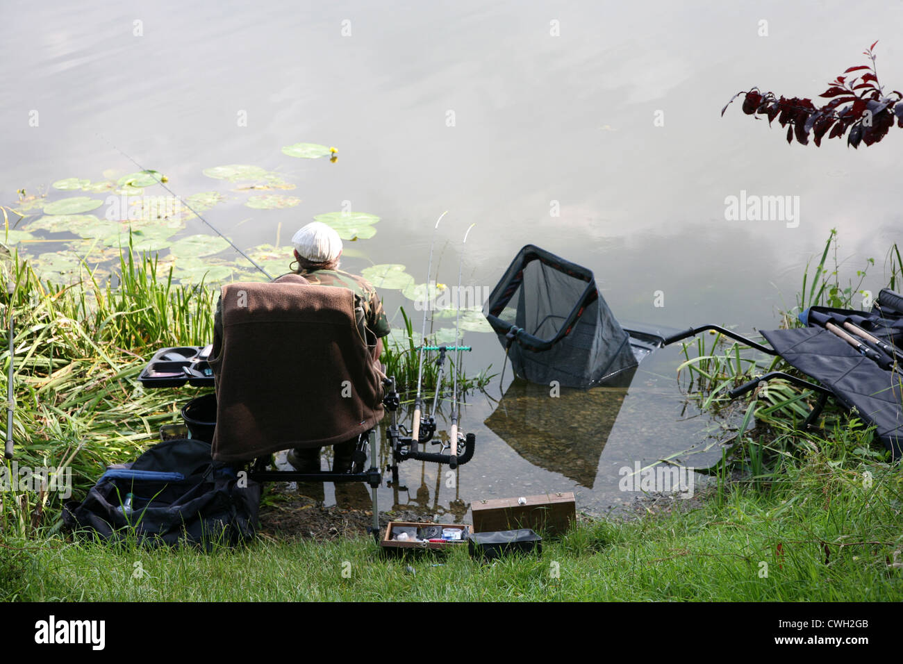 England Dorset Sherborne Sherborne Castle lake with angler Stock Photo ...