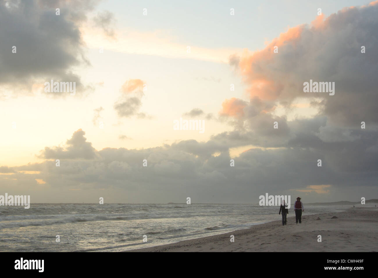 Denmark, People on the beach at sunset Stock Photo - Alamy