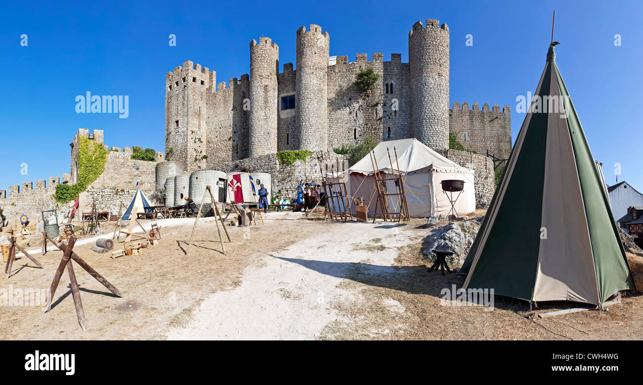 Obidos Castle during the Medieval Fair reenactment. Obidos is a very ...