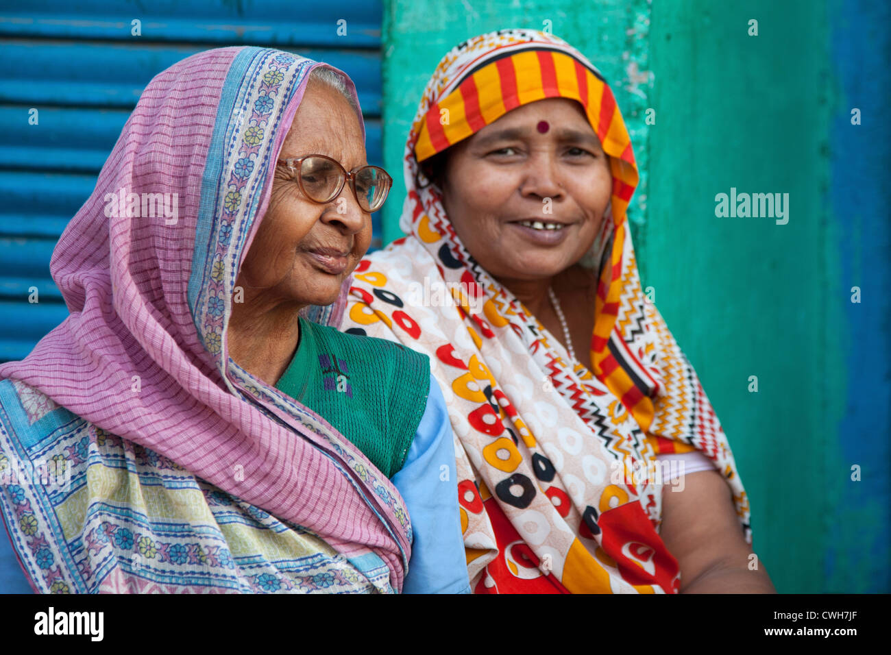 Two Indian women dressed in traditional colourful saris, Agra, Uttar ...