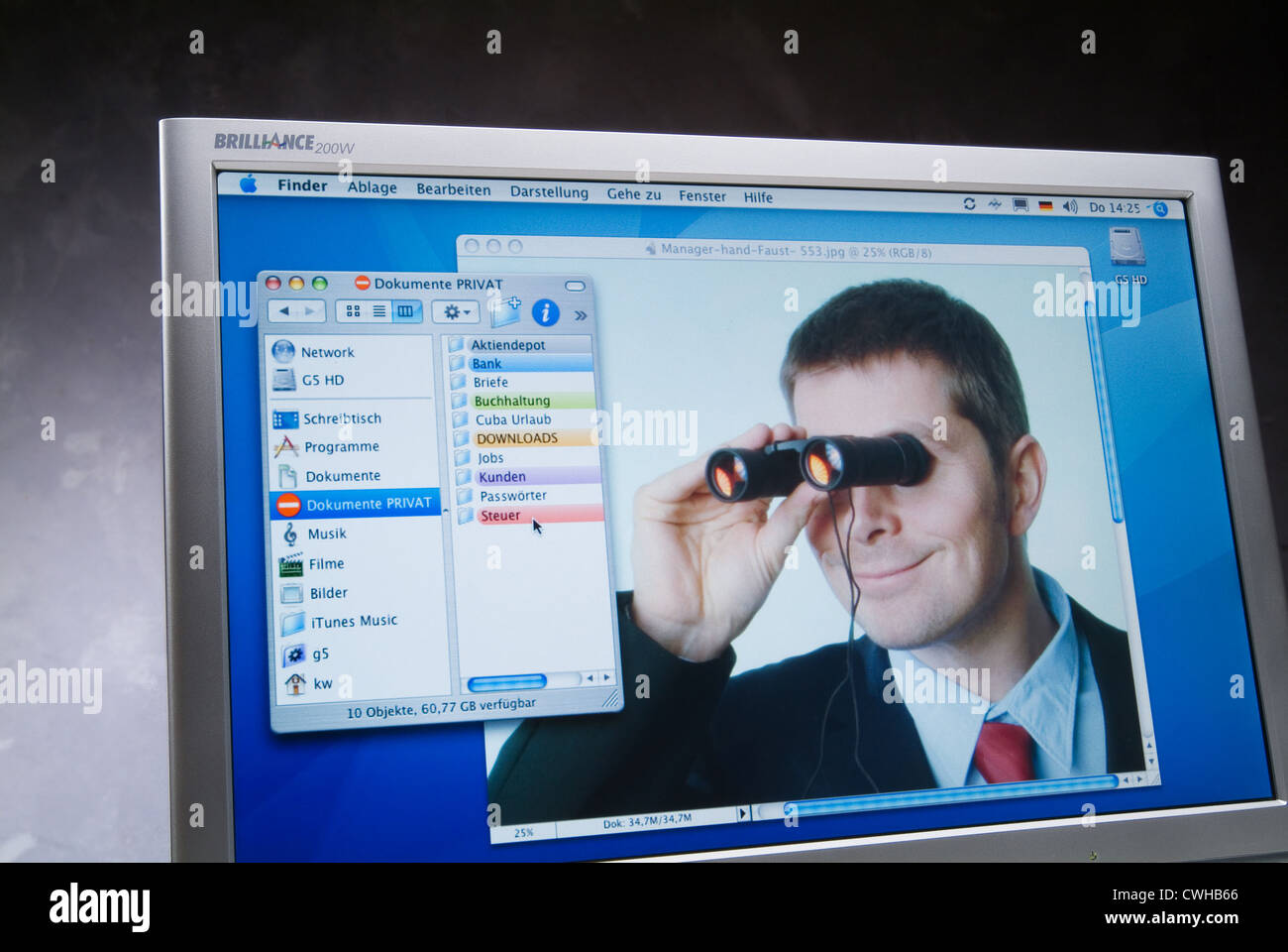Hamburg, Man with binoculars on a computer Stock Photo - Alamy