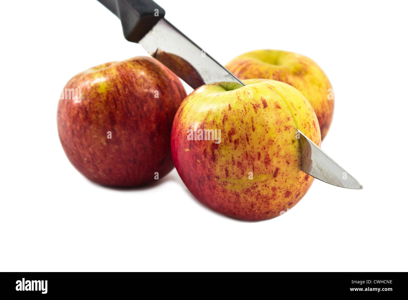 Photo of Stabbed Apples on White Background Stock Photo - Alamy