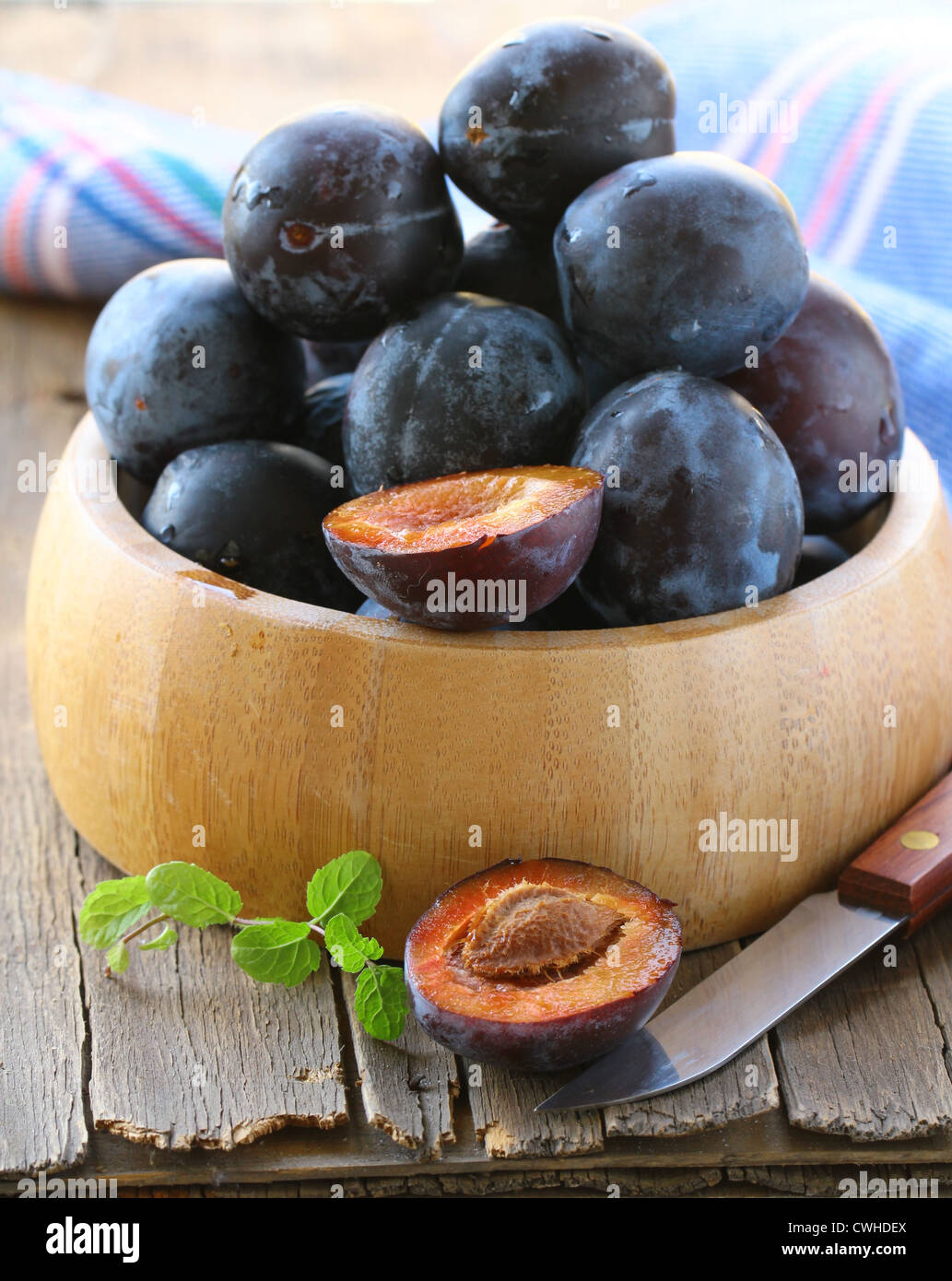 ripe, fresh red plums on the table Stock Photo - Alamy