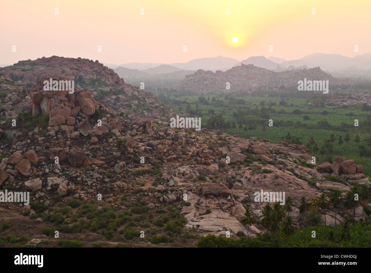 The landscape of Hampi seen from the top of Mathanga Hill at sunrise ...