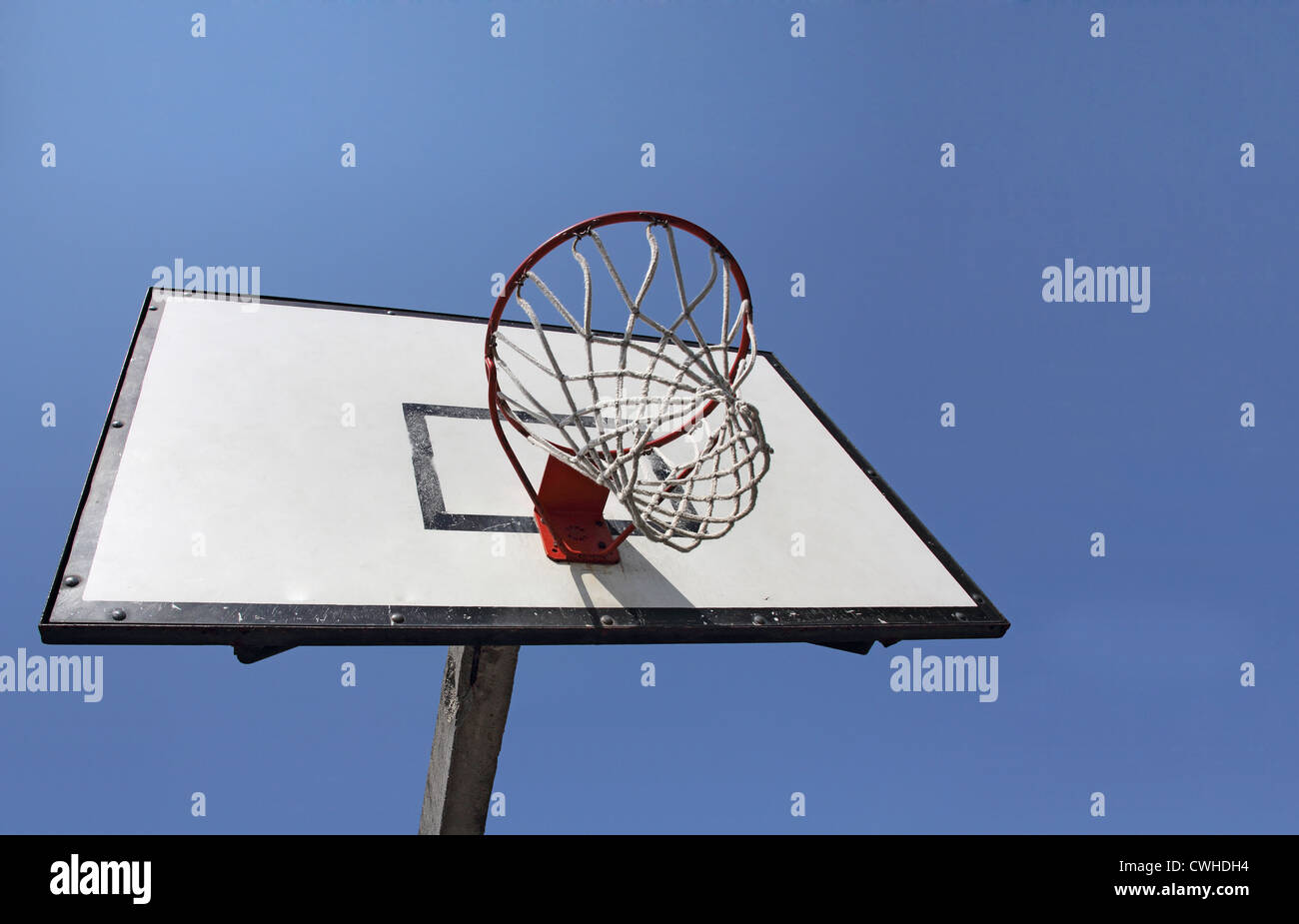 Basketball backboard on the school basketball court under blue sky ...