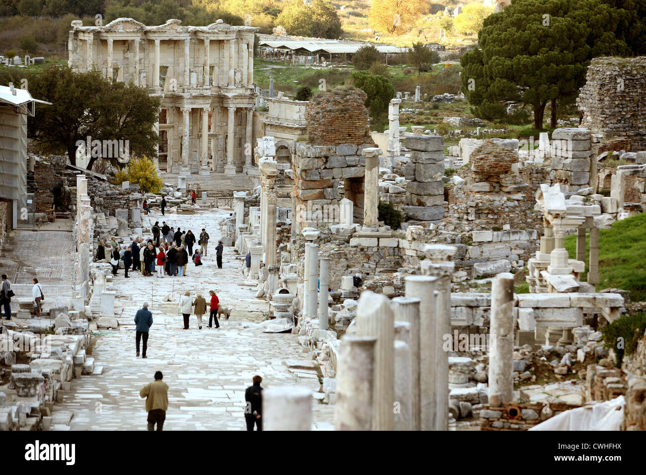 Ephesus, tourists visit the ruins of the city on the Curetes Street ...