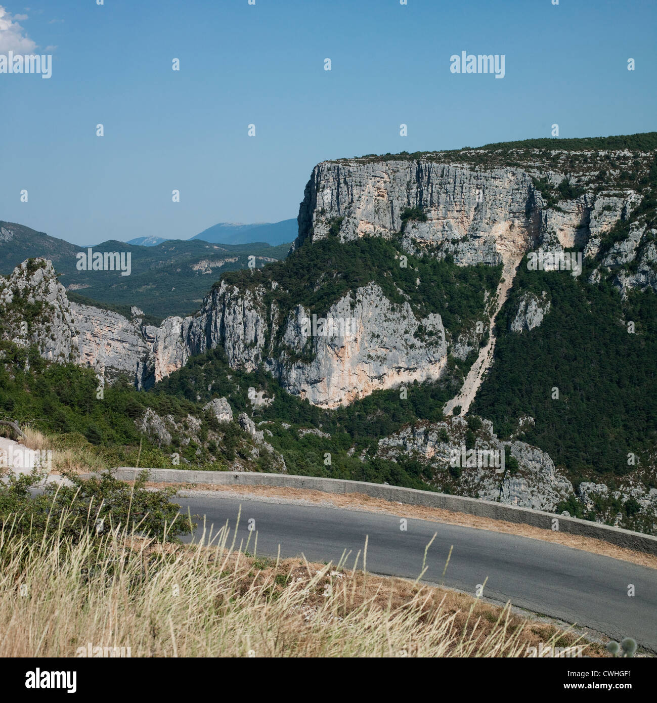 Narrow mountain road bend overlooking cliffs in the Gorges du Verdon ...