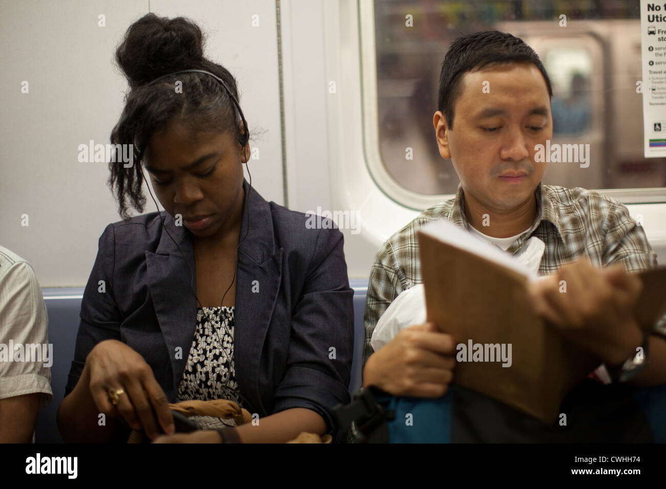 Riding new york subway hi-res stock photography and images - Alamy