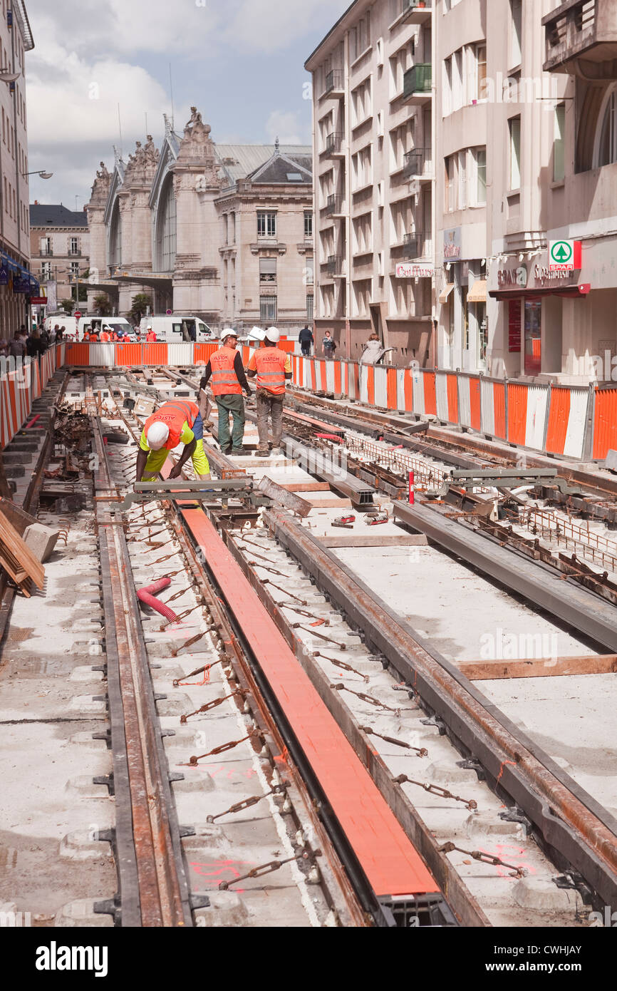 Workmen constructing the new tram system in Tours, France Stock Photo ...