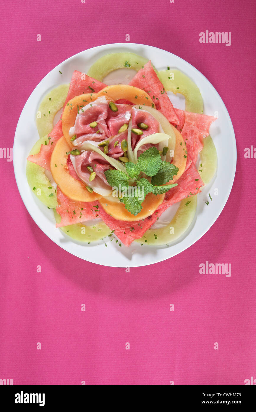 Dish with Three Melons Stock Photo - Alamy