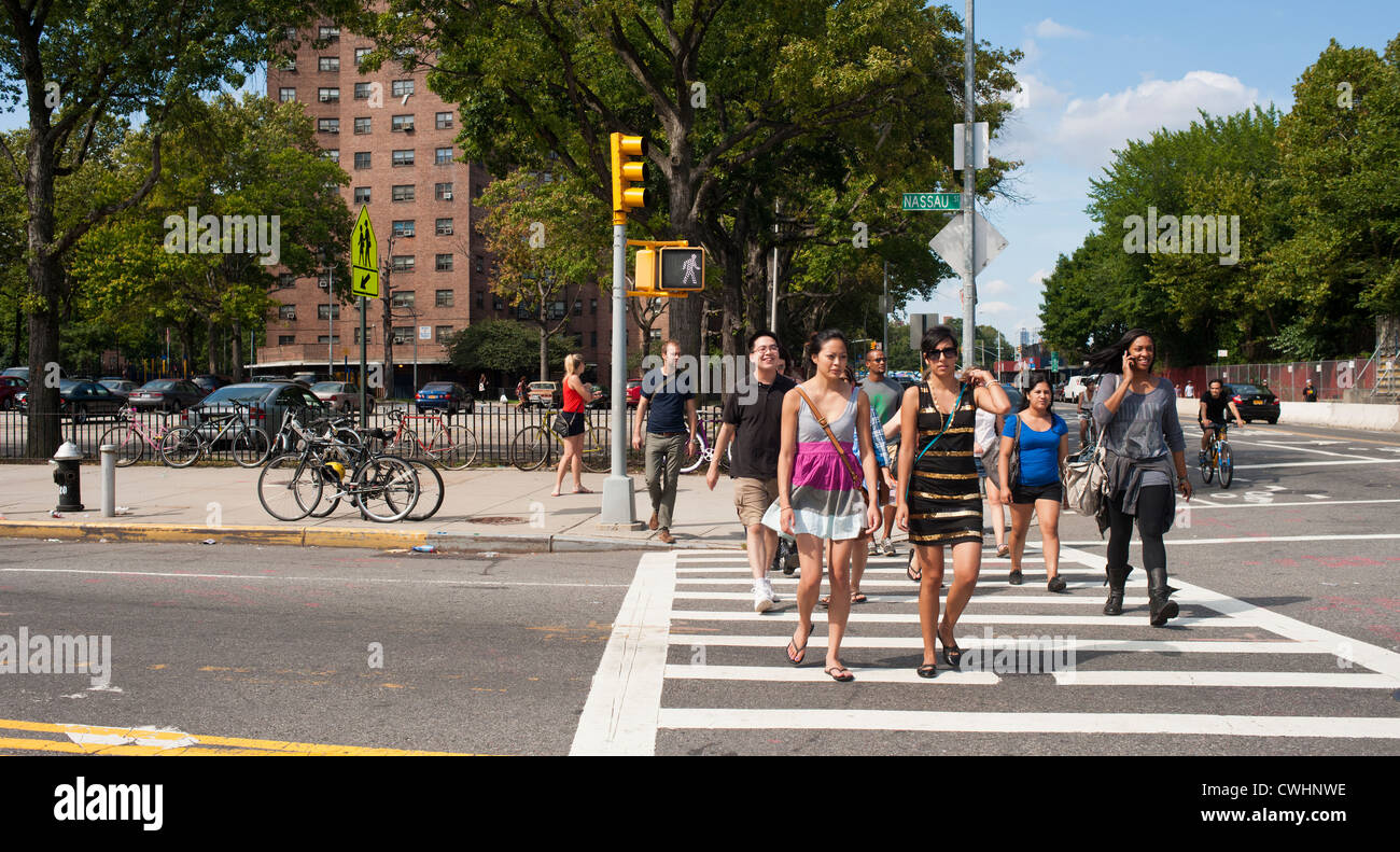 Pedestrians cross the intersection of Nassau and Navy Streets in the ...