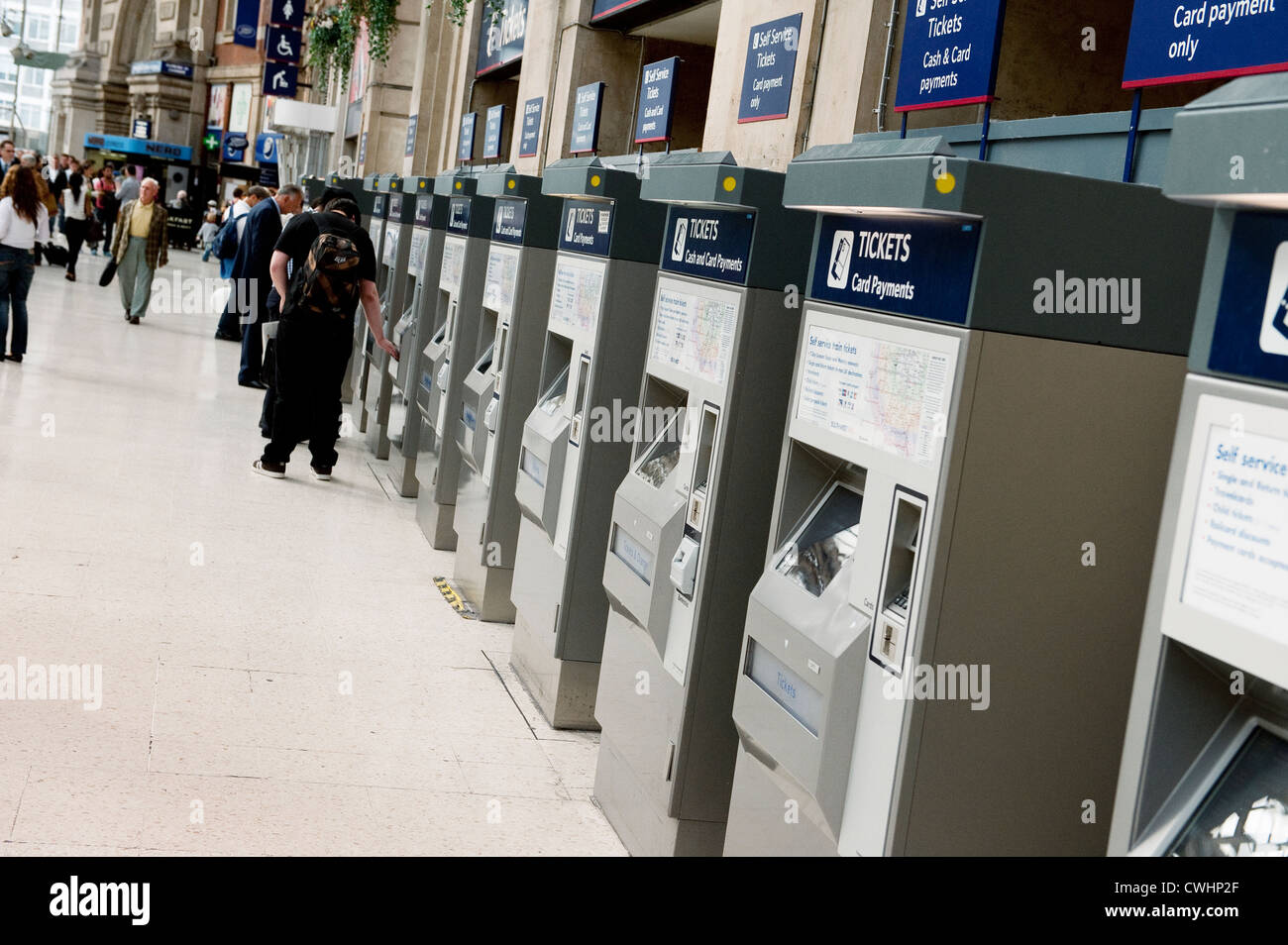Ticket machines in the concourse area of a railway station in England ...