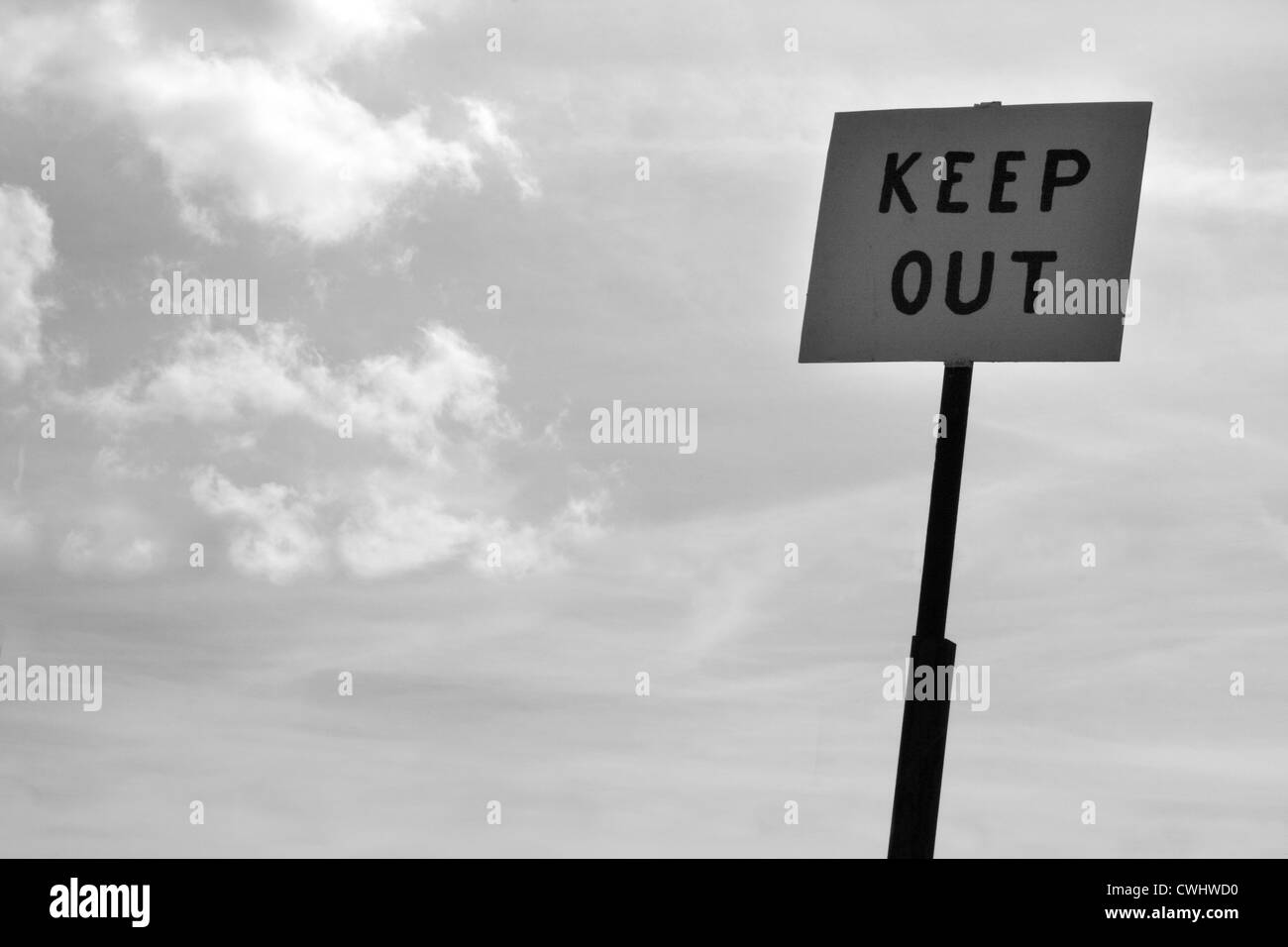 A 'keep out' sign seen against the sky Stock Photo - Alamy
