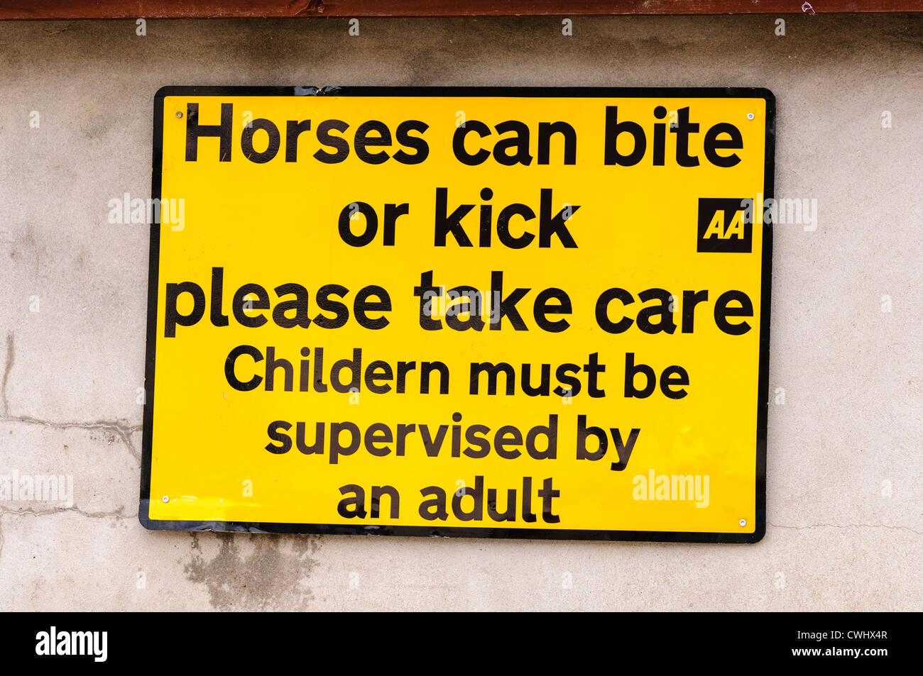 AA Street sign warning that horses can kick and bite, and advising ...