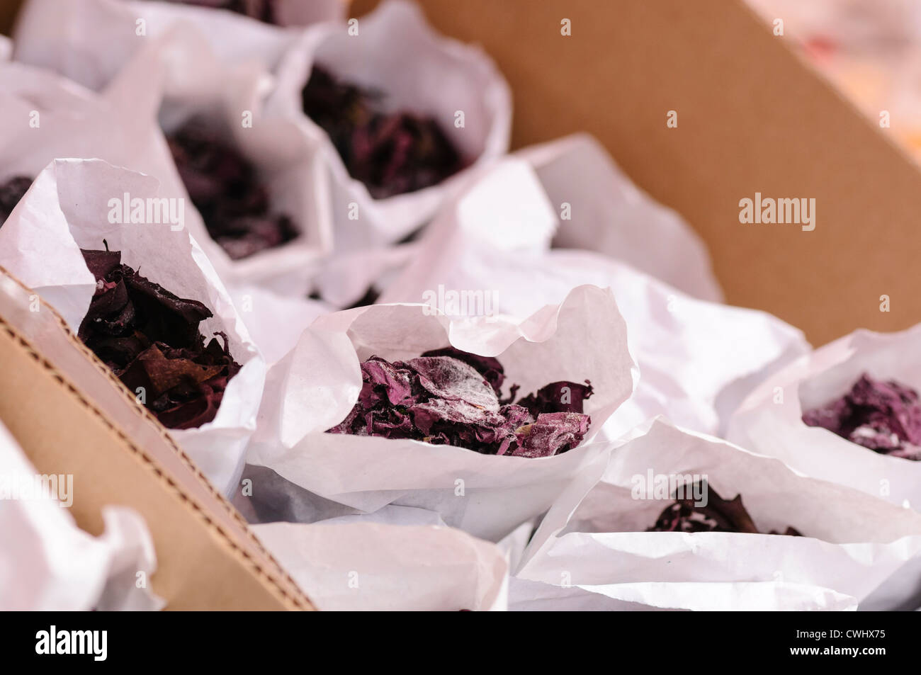 Bags containing Dulse, an edible seaweed, on sale at a market stall ...