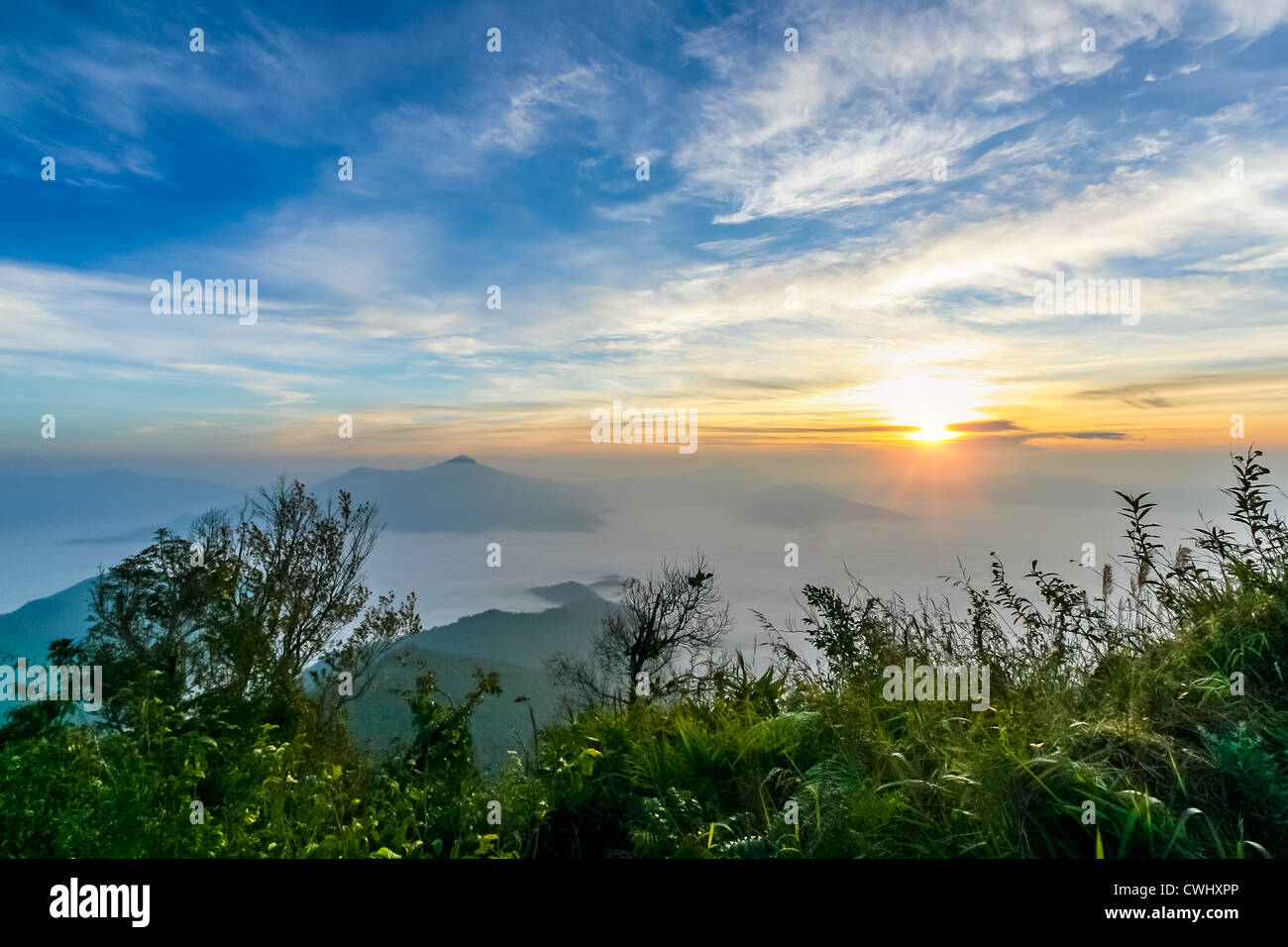 Sunrise in morning time misty early on mountain Stock Photo - Alamy