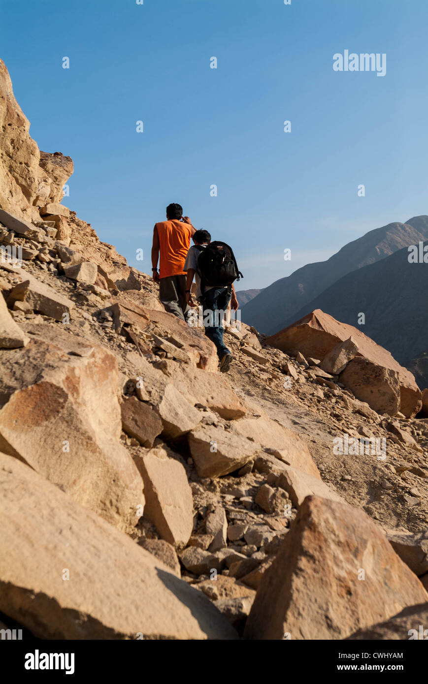 Peruvian guides pointing out petroglyphs at Palpa Peru Petroglyphs of ...