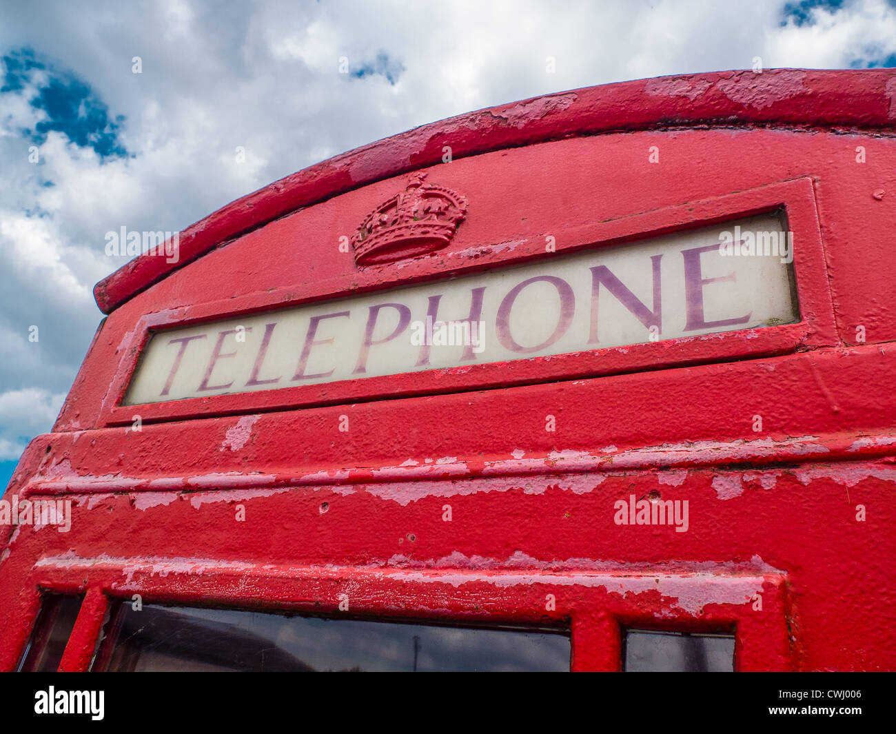 Weathered Red English UK Telephone Box Stock Photo - Alamy