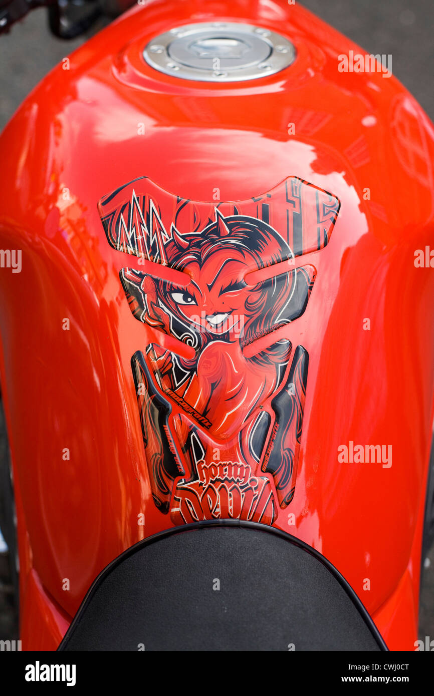 Customized Motor bike fuel tanks with a horny devil Stock Photo - Alamy