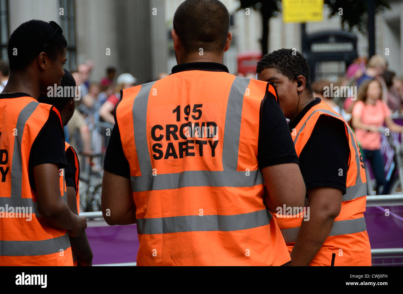 Crowd safety stewards controlling the crowds at the London 2012 Olympic ...