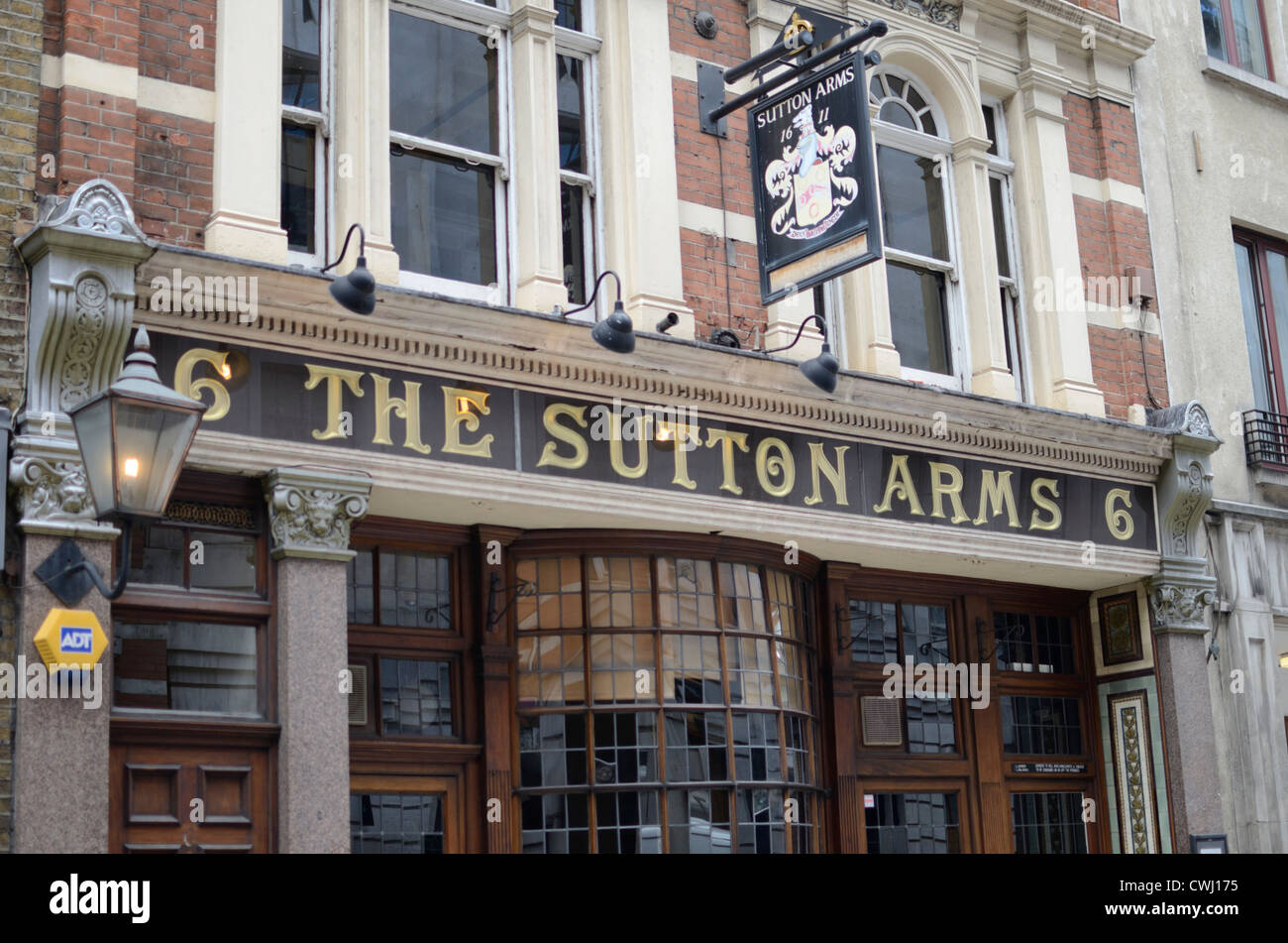 The Sutton Arms pub in Carthusian St, Smithfield, London, England Stock ...