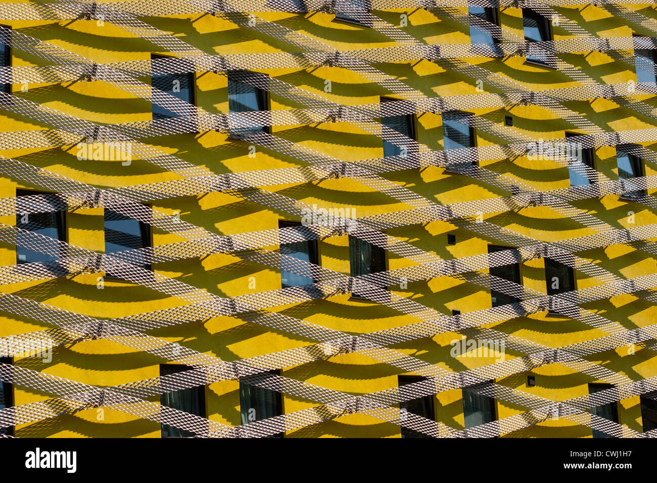 Yellow building with metal lattice in Hackney, London, United Kingdom ...