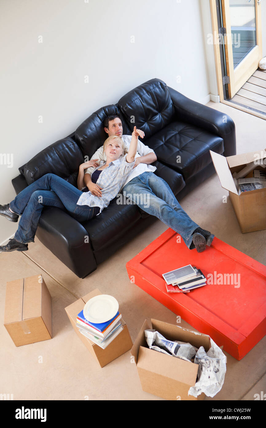 Couple relaxation on sofa in livingroom Stock Photo - Alamy