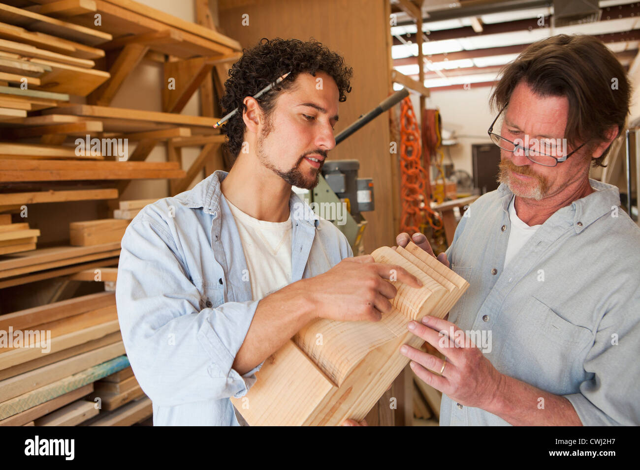 Co-workers woodworking in workshop Stock Photo - Alamy