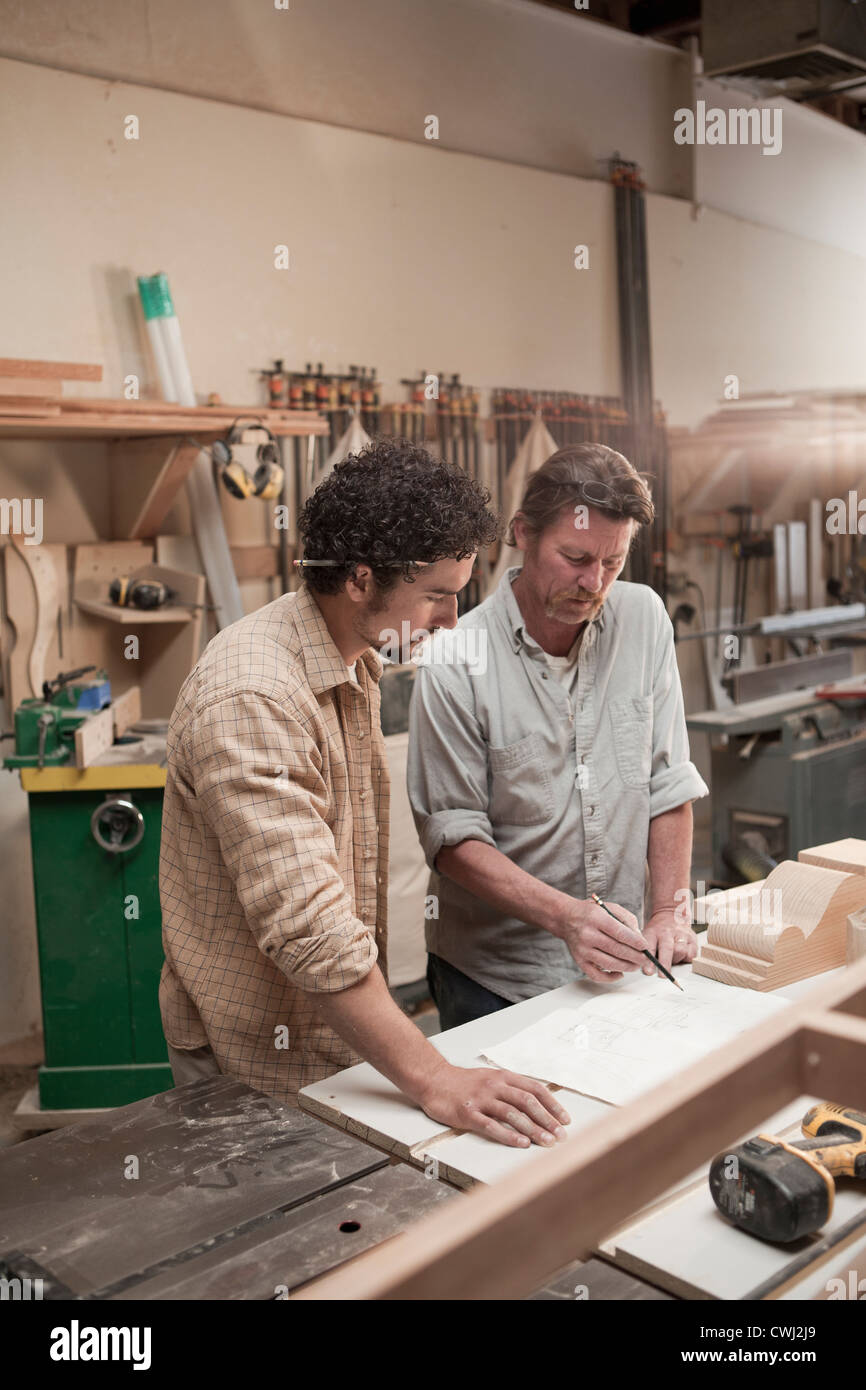 Co-workers woodworking in workshop Stock Photo - Alamy