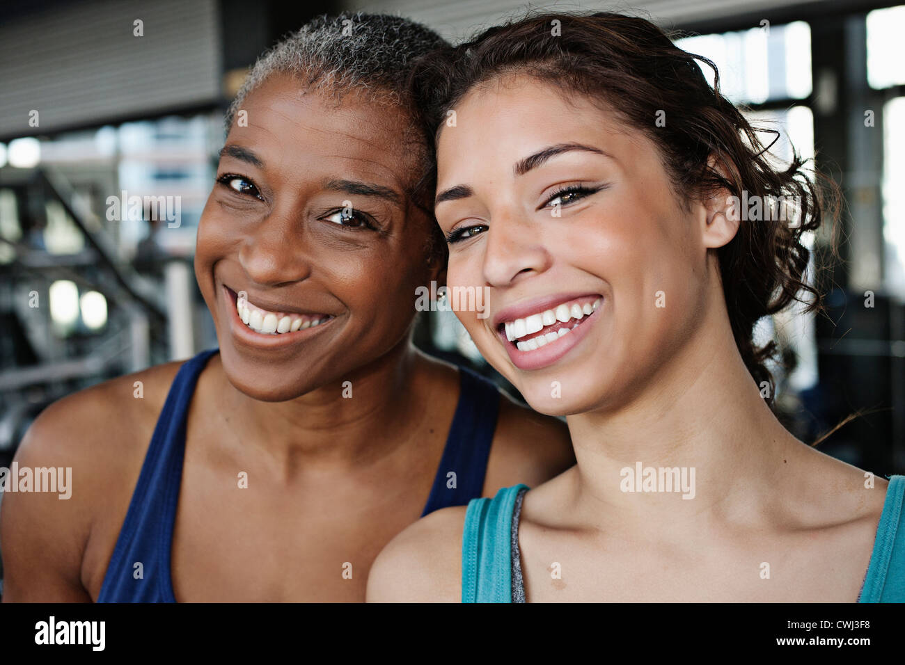 Smiling women in health club Stock Photo - Alamy