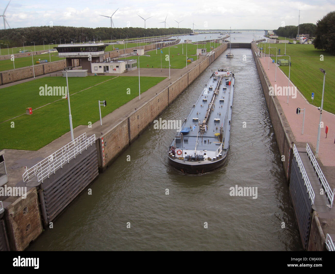 Barge traveling through canal Stock Photo - Alamy