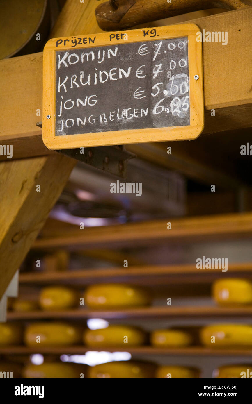 Wooden sign for cheese prices Stock Photo - Alamy