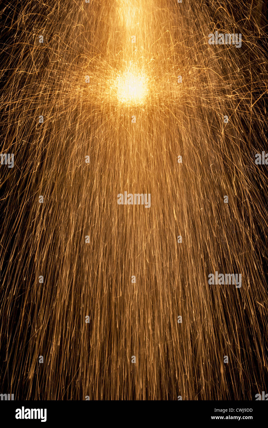 Sparks fly from a grinding wheel Stock Photo - Alamy