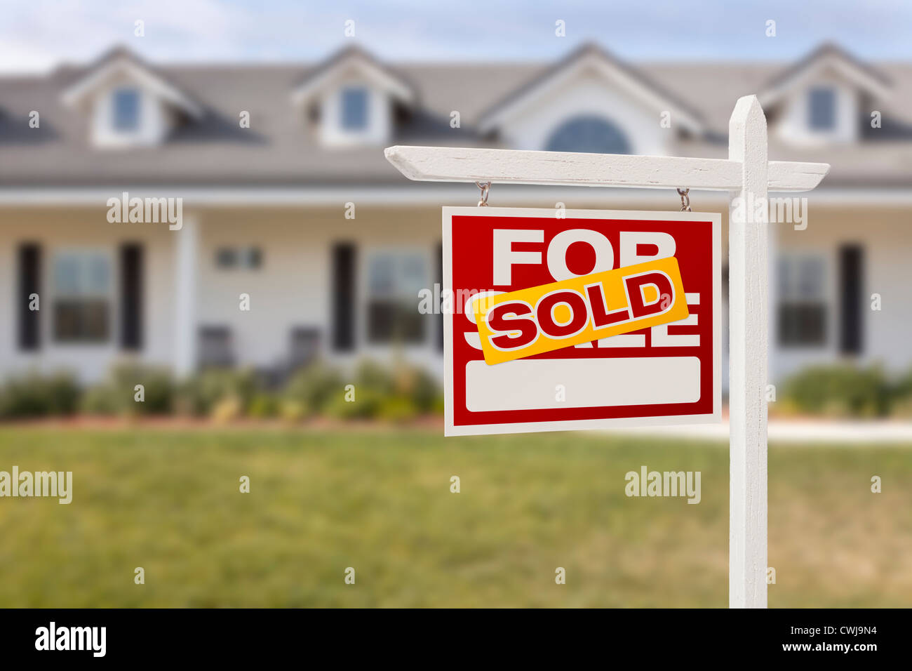Red Sold For Sale Real Estate Sign in Front of House Stock Photo - Alamy