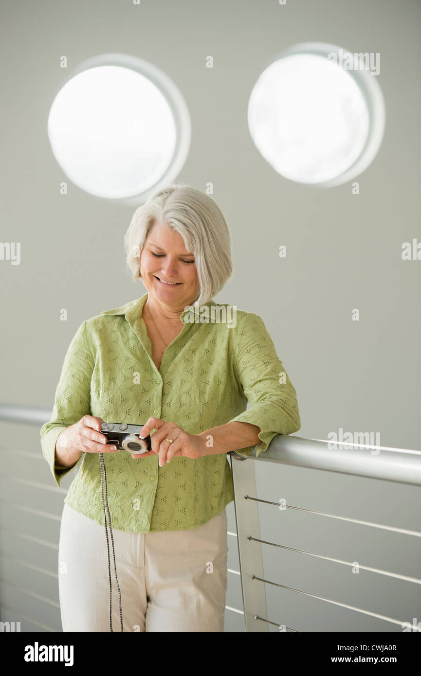 Mature woman reviewing tablet hi-res stock photography and images - Alamy