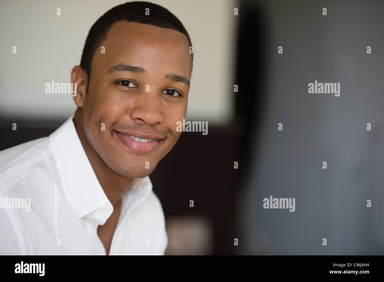 Smiling mixed race man Stock Photo - Alamy Smiling mixed race man Stock Photo - Alamy