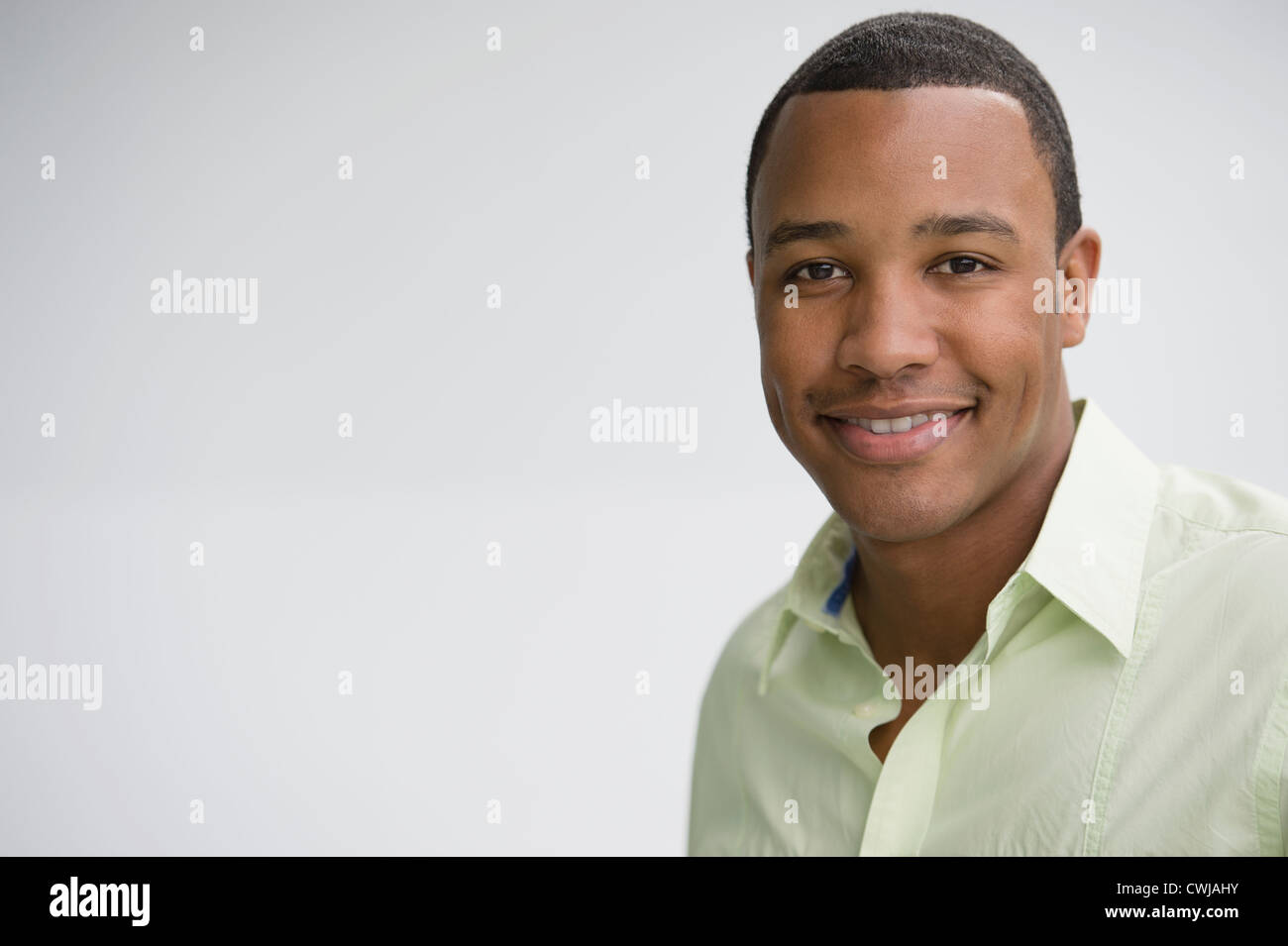 Smiling mixed race man Stock Photo - Alamy
