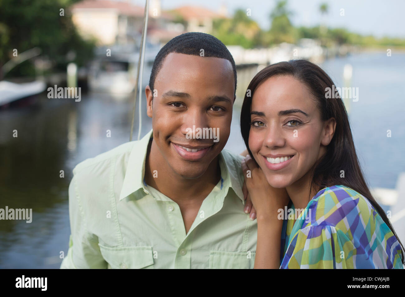 Smiling mixed race couple Stock Photo - Alamy