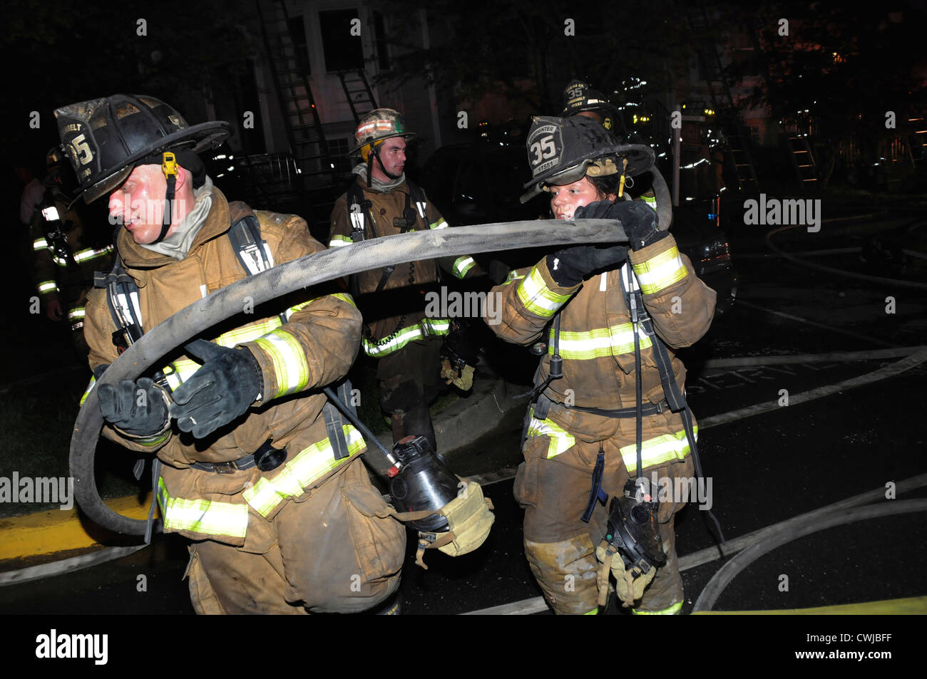Fireman firefighters hose hi-res stock photography and images - Alamy