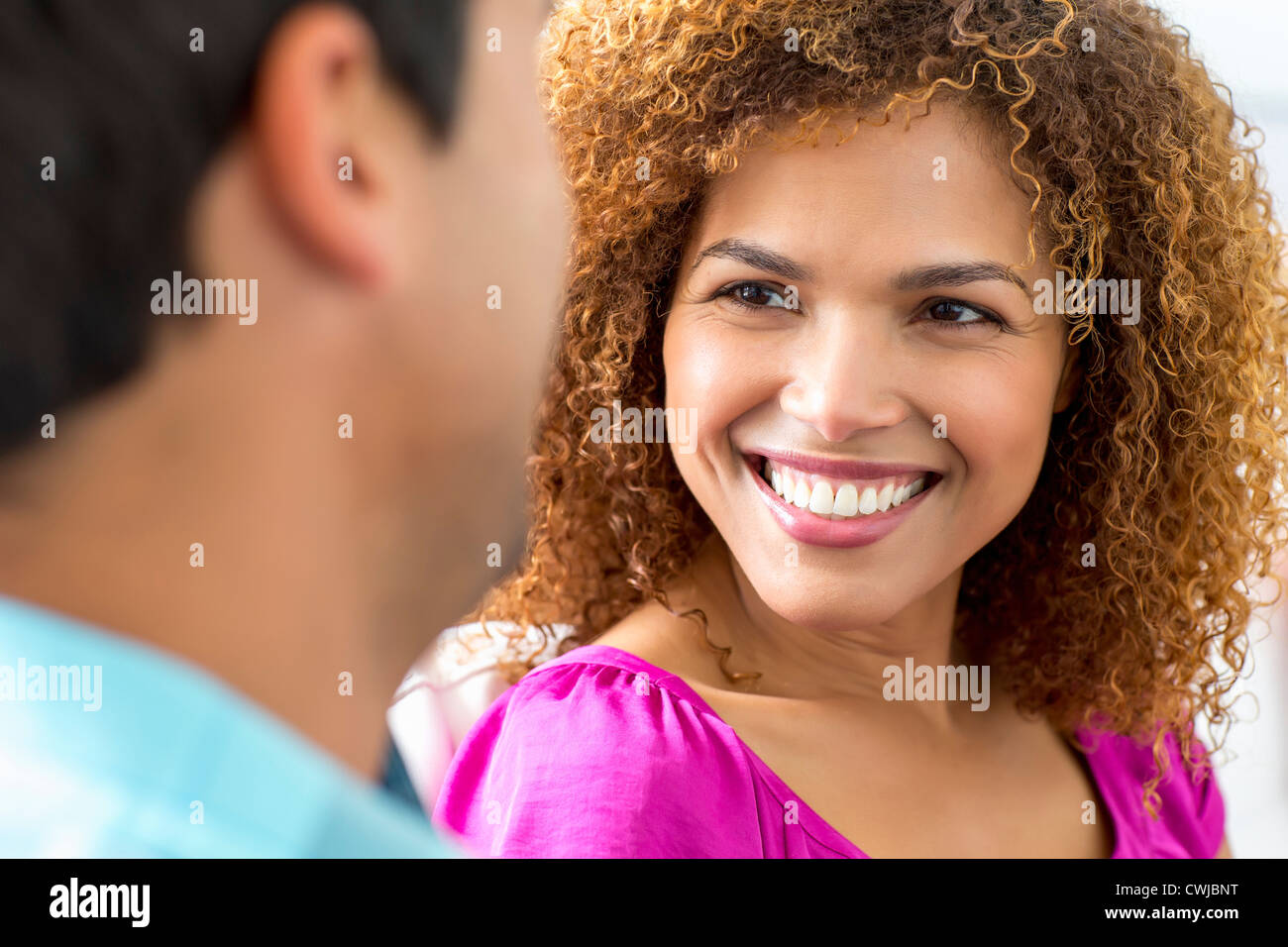 Mixed race couple talking together Stock Photo - Alamy