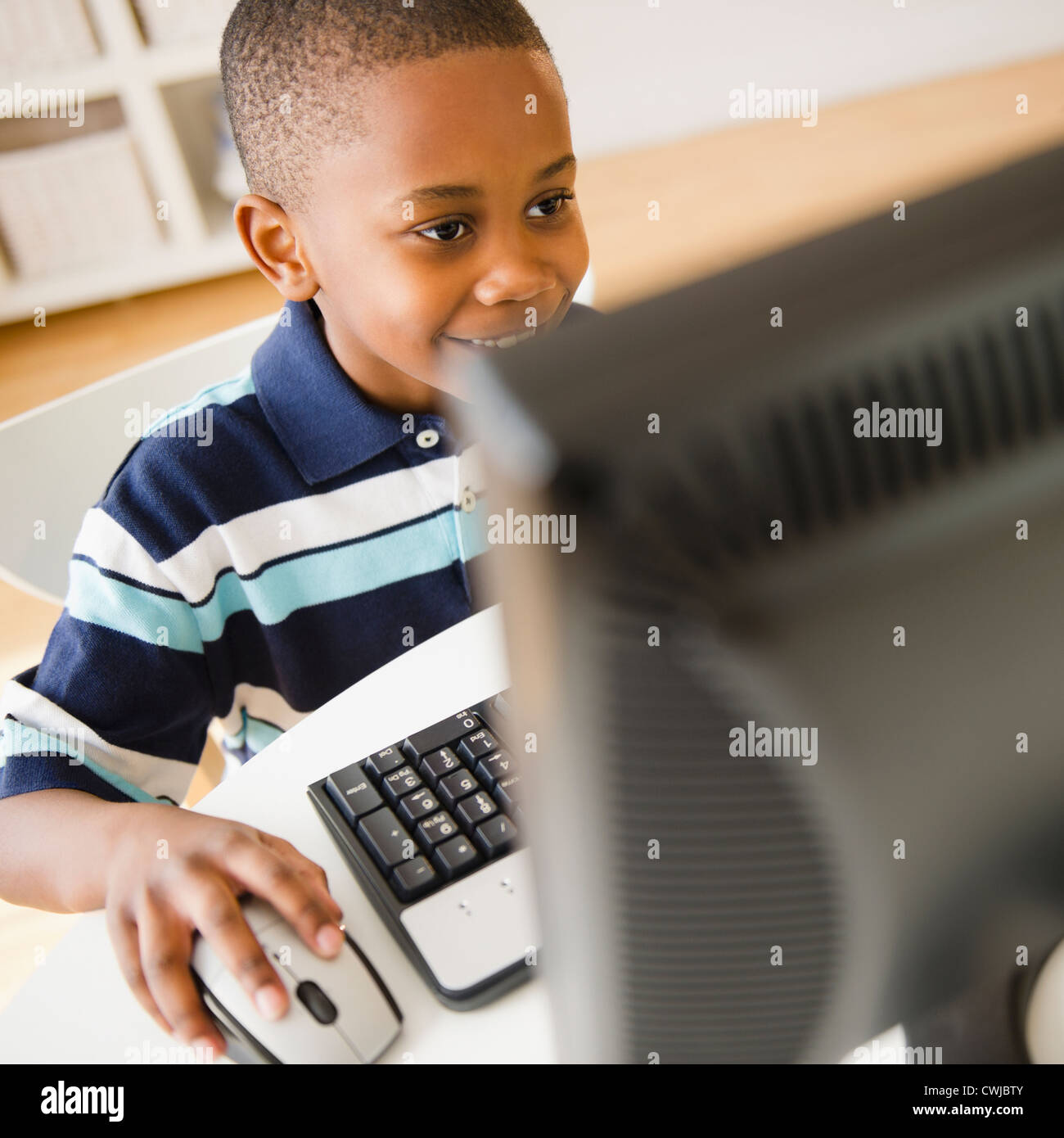 Black boy using computer Stock Photo - Alamy