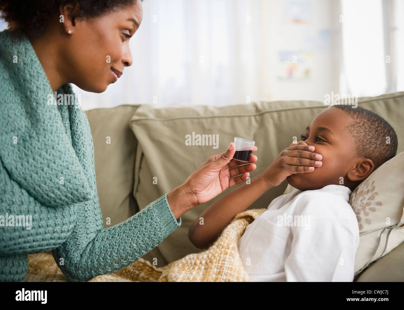 Mother tending sick child hi-res stock photography and images - Alamy